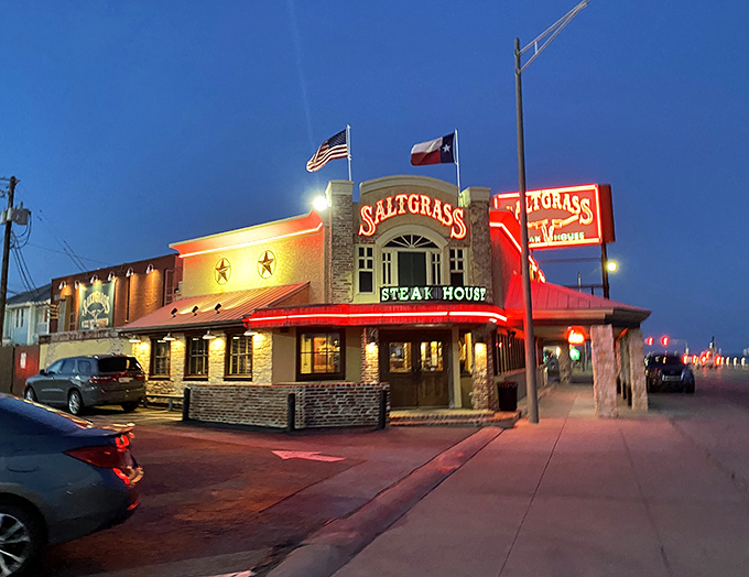 Saltgrass stands proud against the Texas sky, its neon sign a beacon for hungry travelers along Galveston's Seawall.