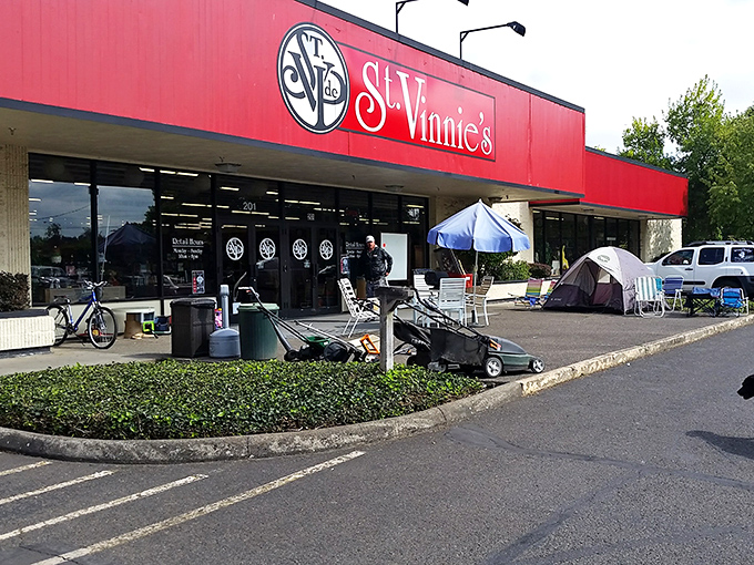 St. Vinnie's bold red storefront promises bold bargains inside. Even the lawn mowers outside are looking for new homes!
