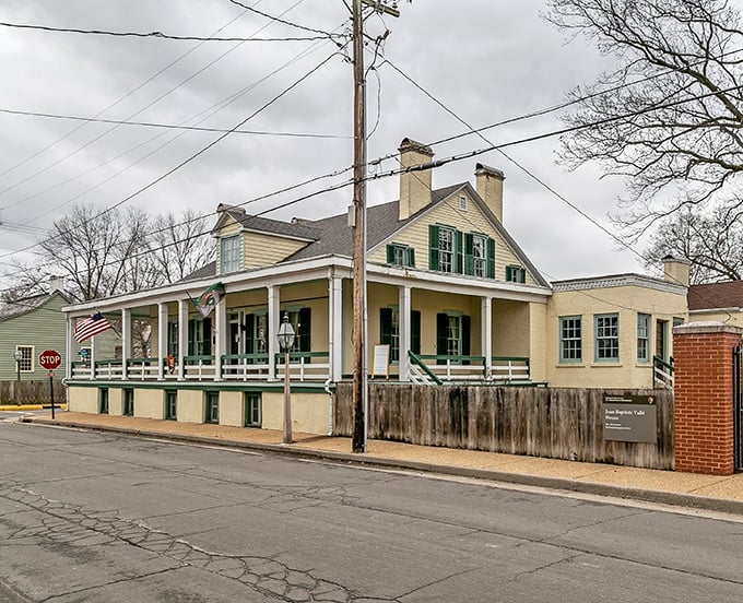 This yellow colonial home with its wraparound porch practically begs for lemonade sippers. Southern charm meets French colonial style!