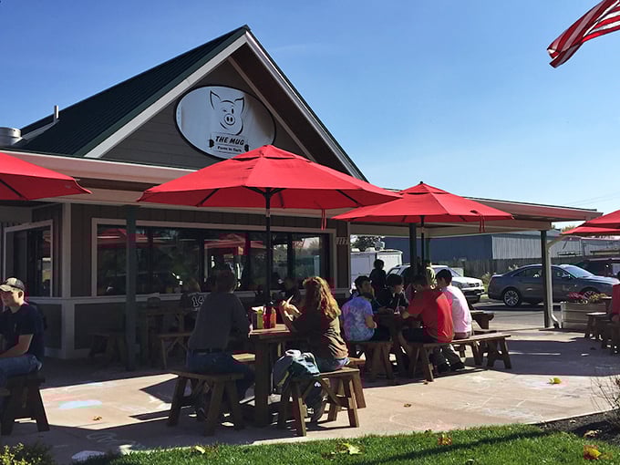 The Mug's cheerful pig logo and red umbrellas promise good times and even better tenderloins. 