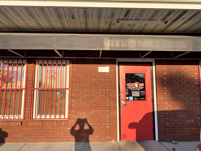 Behind that unassuming brick exterior and bright red door lies sandwich greatness that would make a food critic weep tears of mustard-tinged joy.