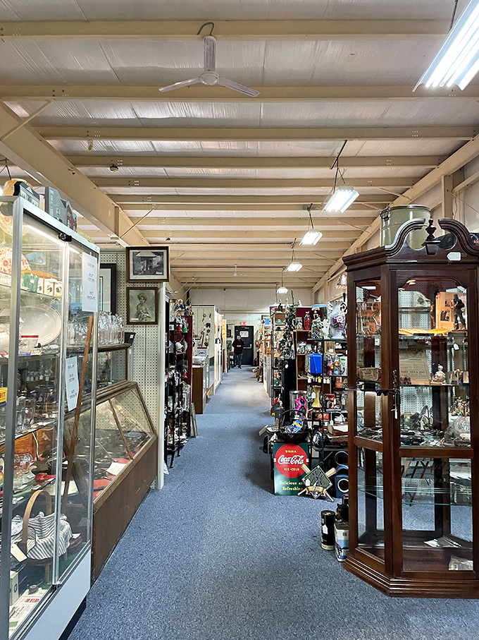 Long aisles of glass cases at Antique Crossroads showcase treasures big and small. A museum where everything has a price tag!