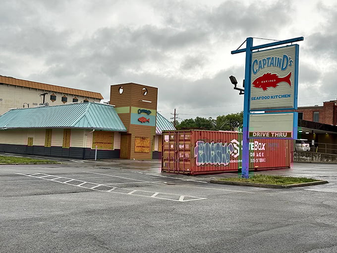 Rain-slicked parking lot can't dampen the promise of that seafood sign. Sometimes comfort food is exactly what we need.