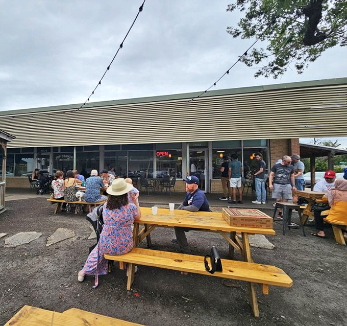 Community happens naturally at these picnic tables, where strangers become friends over the universal language of great sandwiches. 