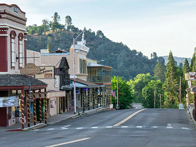 The tree-lined streets of Mariposa showcase the town's well-preserved Gold Rush architecture against a backdrop of rolling California hills.