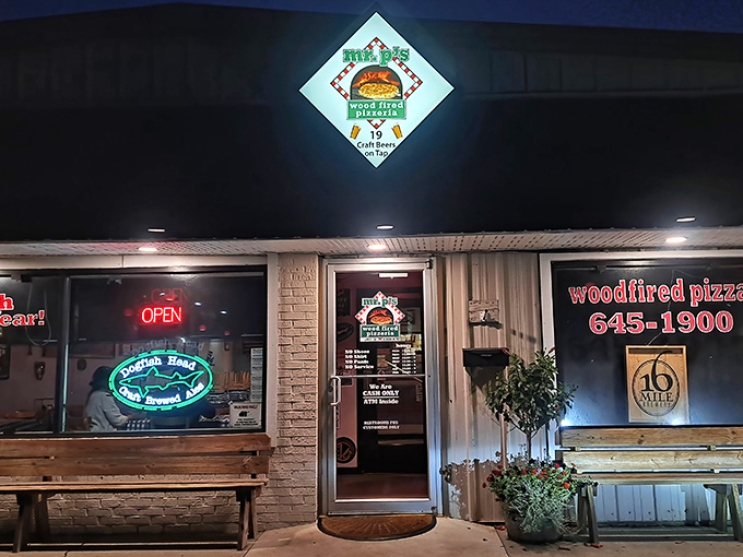 Night falls, but Mr. P's glowing sign guides pizza pilgrims home. Those craft beers on tap are calling your name.