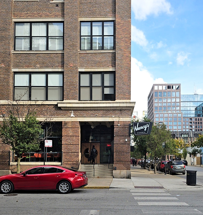 The urban sophistication of Nancy's exterior matches the elevated pizza experience waiting inside.
