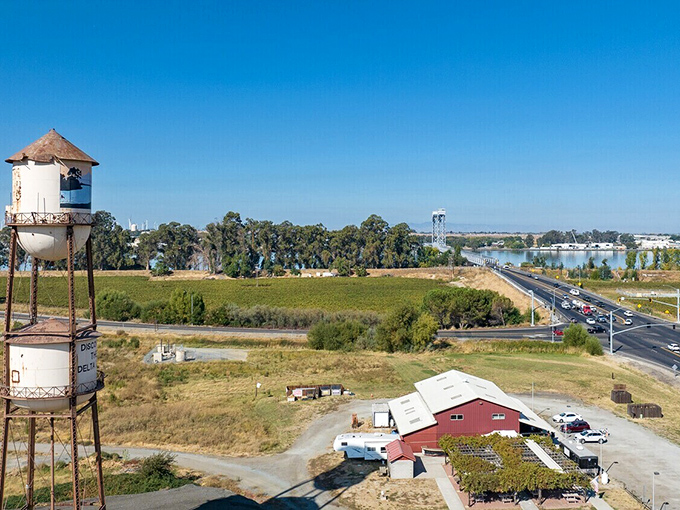 Rio Vista's iconic water tower stands tall against clear blue skies, a sentinel watching over this affordable riverside haven.