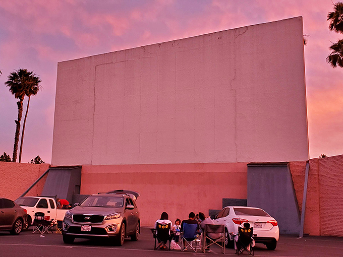 Pink skies and palm trees frame the massive screen at Rubidoux, California's answer to cinema paradise.