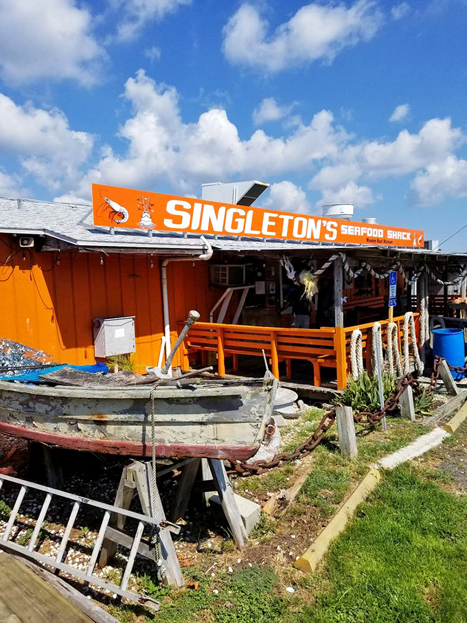 Maritime artifacts and bright colors announce you've found the real deal—a genuine Florida fish shack where freshness trumps formality.