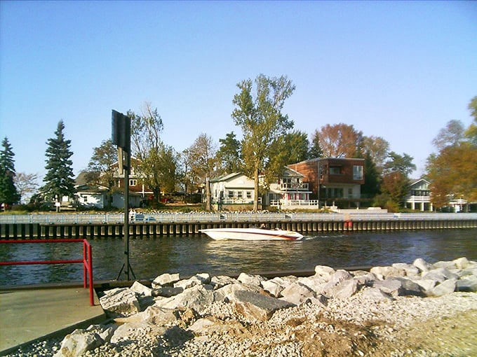 With a hint of fall in the trees and a boat gliding by, South Haven&rsquo;s harbor holds onto the season&rsquo;s last golden days.