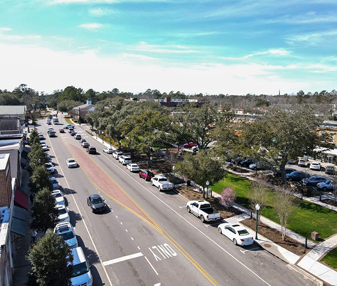 "Summerville's tree-lined boulevard stretches toward the horizon like a postcard come to life. Southern charm with room to breathe."