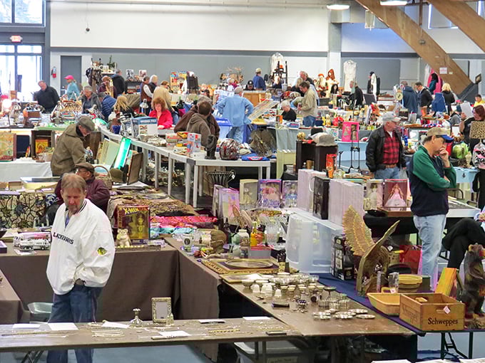 Midnight madness in full swing! Tables laden with potential heirlooms while shoppers circle like friendly sharks sensing the perfect deal.