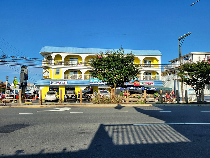 Three stories of seafood satisfaction in cheerful beach yellow. The perfect landmark for hungry beachgoers with crab on their minds.