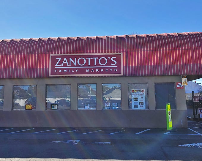 Zanotto's distinctive red-striped awning waves like a flag, signaling sandwich excellence awaits inside this family market.