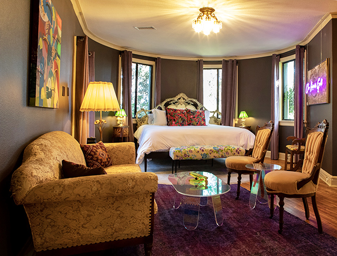 Regal without being stuffy&mdash;this bedroom's dramatic color palette and curved walls create a space worthy of royalty (or at least a really good nap).