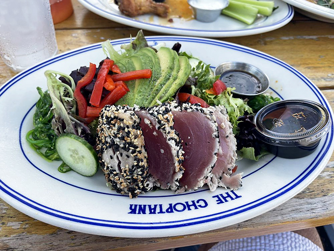 Sesame-crusted ahi tuna that's living its best life alongside a garden of fresh vegetables. Ocean meets farm in perfect harmony.