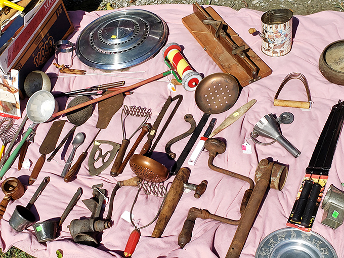 Grandma's kitchen tools laid out like archaeological treasures&mdash;each patina-covered implement holding decades of Sunday dinner stories.