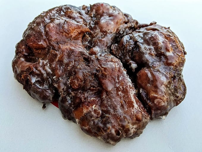 This apple fritter isn't just a donut&mdash;it's a topographical marvel of crispy peaks and valleys glistening with sweet glaze.