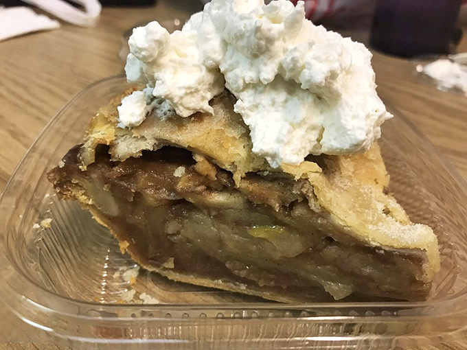 This slice of apple pie isn't just dessert, it's edible nostalgia that makes you wonder if your grandmother moonlights in Oakland.