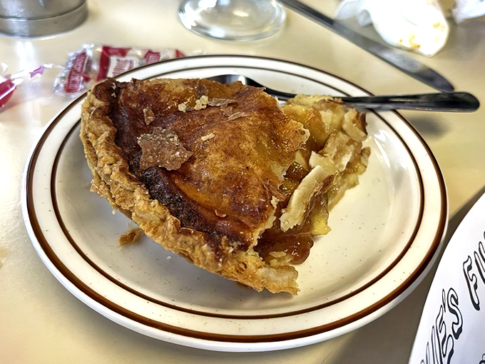 Apple pie that would make your grandmother both jealous and proud. The flaky crust practically whispers "1955" with each buttery bite.