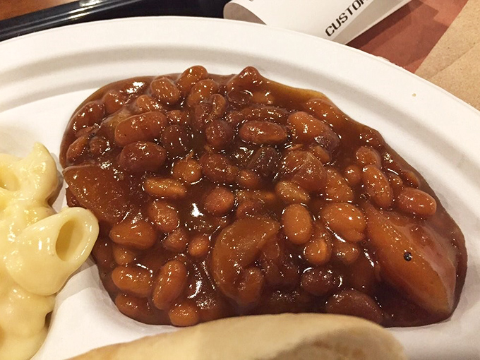 These aren't your campfire baked beans &ndash; they're smoky, sweet little flavor bombs studded with brisket bits that'll make you forget mac and cheese exists.