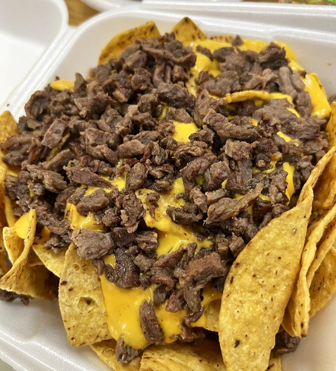 Nachos that laugh in the face of stadium concessions. Every chip gets its fair share of meat, cheese, and dignity.