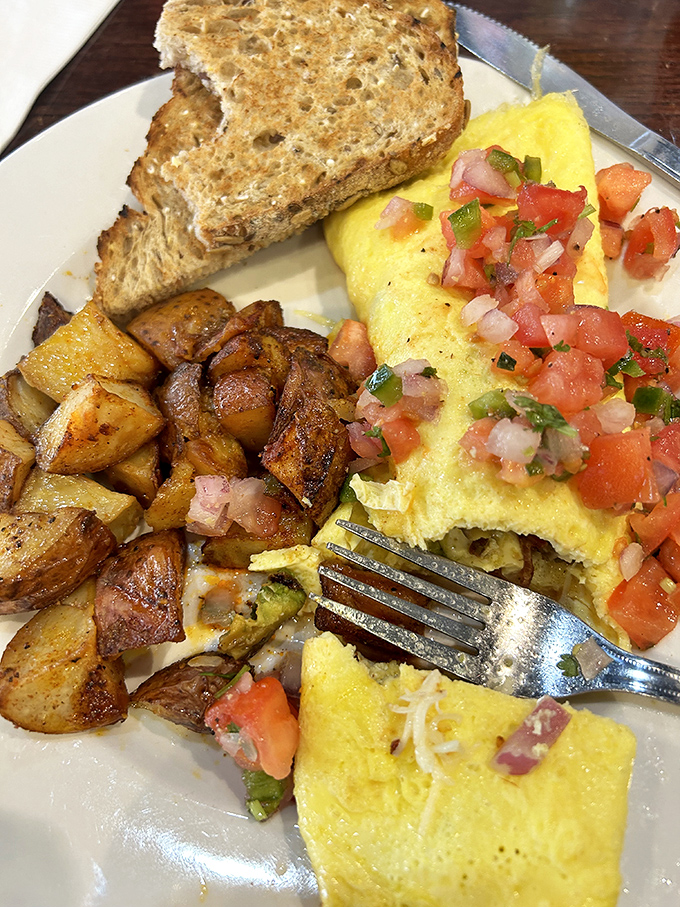 This omelet brings its A-game with perfectly diced potatoes and toast that's actually worthy of the eggs it accompanies.