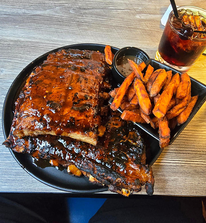 These ribs don't just fall off the bone&mdash;they practically leap toward your mouth, glistening with sauce that deserves its own fan club.