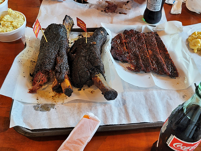 Beef and pork ribs with bark so magnificent, archaeologists should be studying it. Caveman food elevated to fine art.