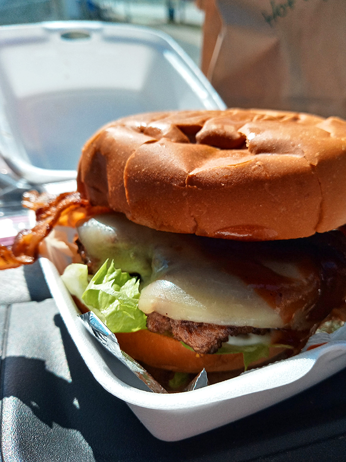 This isn't just a burger&mdash;it's edible architecture. The melted cheese cascading down those patties would make Frank Lloyd Wright weep with joy.