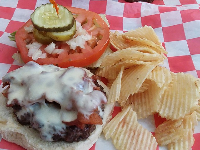 When a burger is done right, you don't need fancy toppings or pretentious brioche. Just melty cheese, fresh toppings, and a handful of chips.