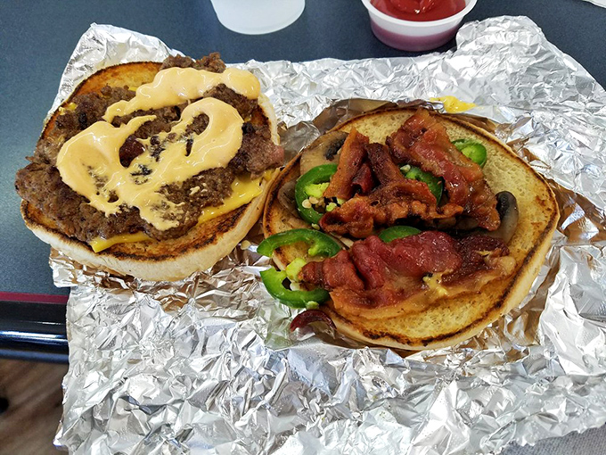 The open-faced burger reveals the architecture of flavor &ndash; each layer visible like a delicious geological cross-section of happiness.