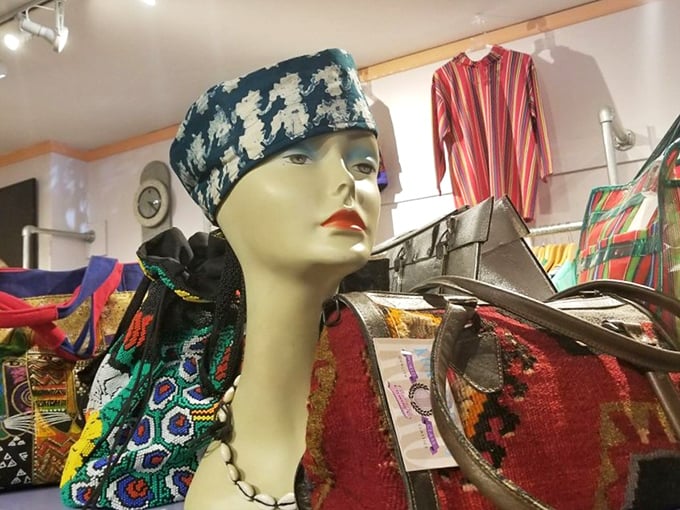The mannequin sports a patterned headscarf that would make Madonna's "Desperately Seeking Susan" era proud. Vintage bags await their next adventure.