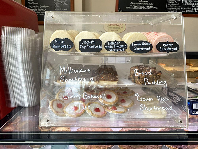 Behind glass doors, shortbread cookies and tarts wait patiently like contestants on The Great British Baking Show, each hoping to be your champion.