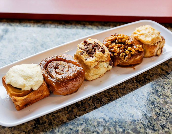 The sticky bun sampler plate&mdash;or as I call it, "Why choose when you can have it all?" Each variety offers a different pathway to bliss.