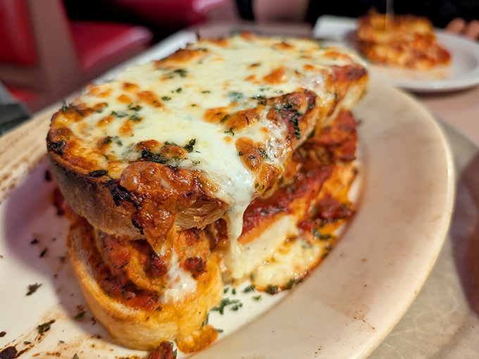 When a meatball sub wears a melted cheese blanket this glorious, you know you're dealing with serious comfort food professionals.