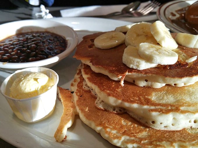 These pancakes aren't just breakfast&mdash;they're dessert with permission. Topped with fresh bananas and ready for their maple syrup baptism.