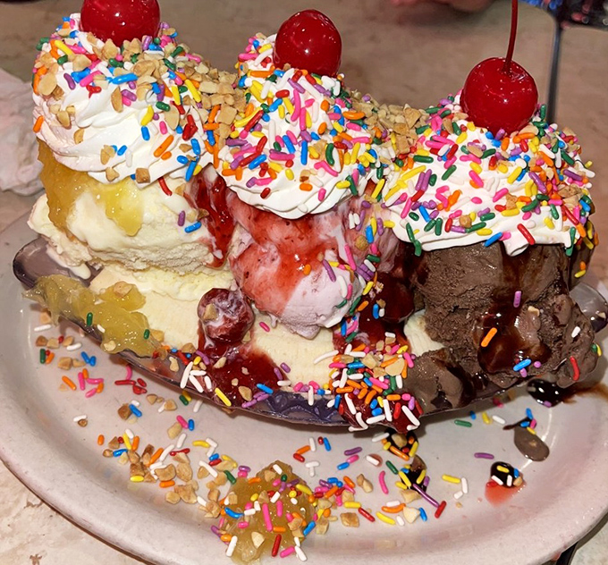 The famous banana split in all its glory&mdash;where sprinkles rain down like confetti at a dessert parade.