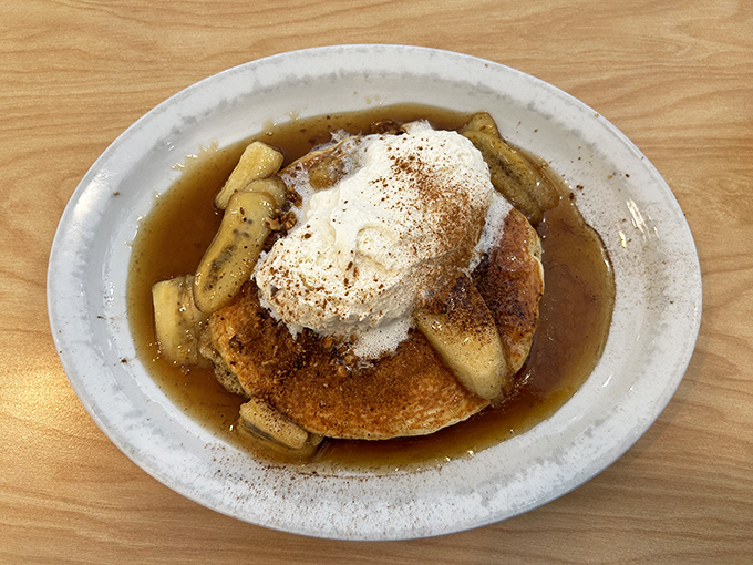 Bananas Foster pancakes crowned with a cloud of whipped cream&mdash;dessert masquerading as breakfast, and nobody's complaining.