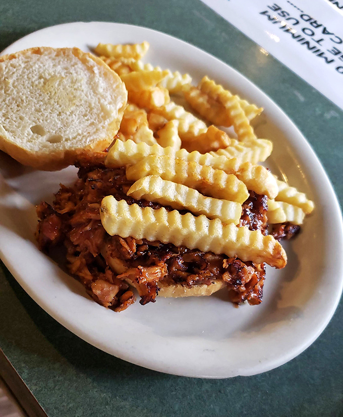 The BBQ sandwich that doesn't need a fancy pedigree – just crispy fries, toasted bread, and meat that speaks for itself.