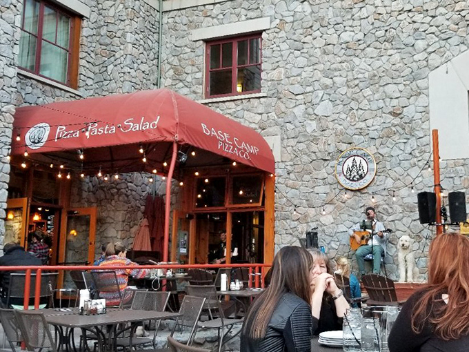 At Base Camp Pizza Co., outdoor dining comes with a side of live music and mountain air &ndash; the kind of atmosphere that makes even plain cheese taste extraordinary.
