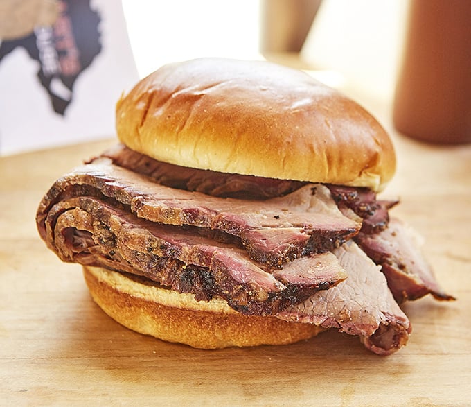 Brisket so tender it practically surrenders at first glance. The sandwich that makes Texans nervously check their rearview mirrors.