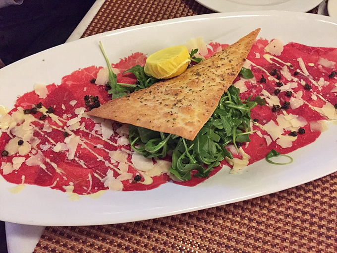 Carpaccio so elegantly presented it belongs in the High Museum of Art. Thinly sliced beef that practically melts before your fork makes contact.