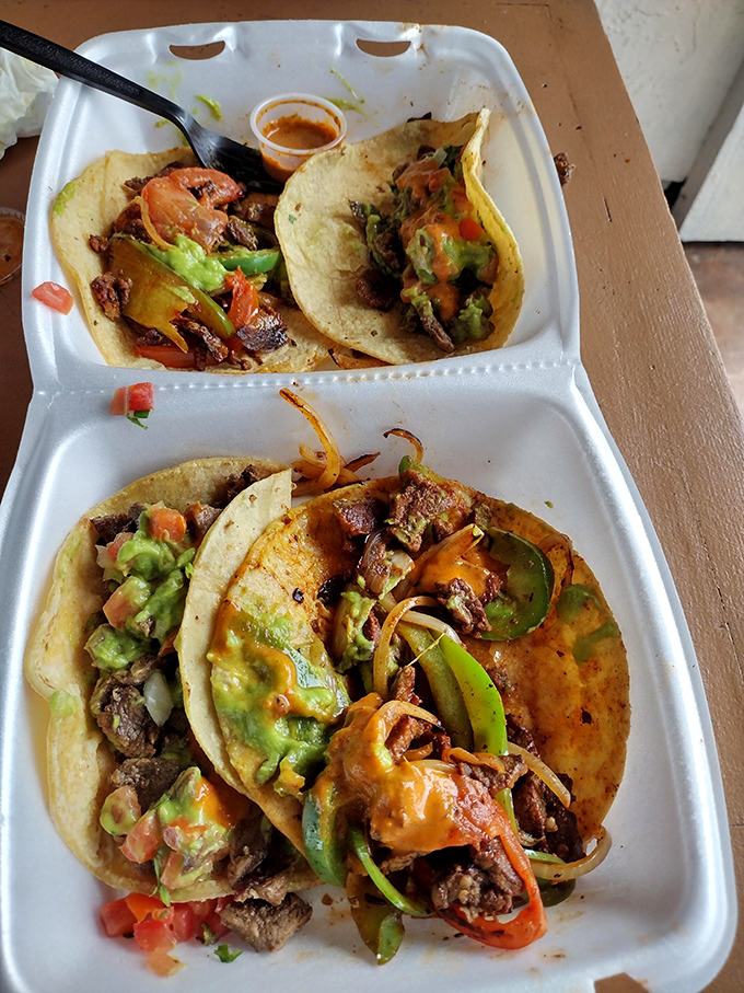 These street tacos aren't just served&mdash;they're presented with pride. The splash of color from guacamole and pico de gallo is nature's perfect garnish.