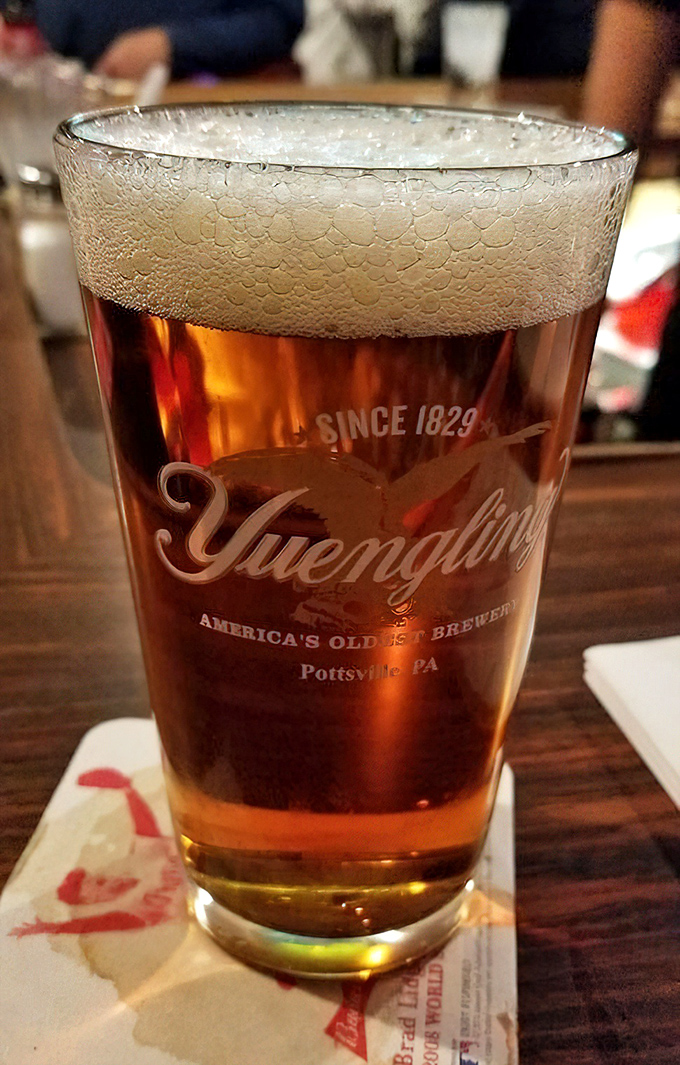 A perfectly poured Yuengling—America's oldest brewery represented in a glass that's sweating almost as much as you are after climbing the Pennsylvania hills.