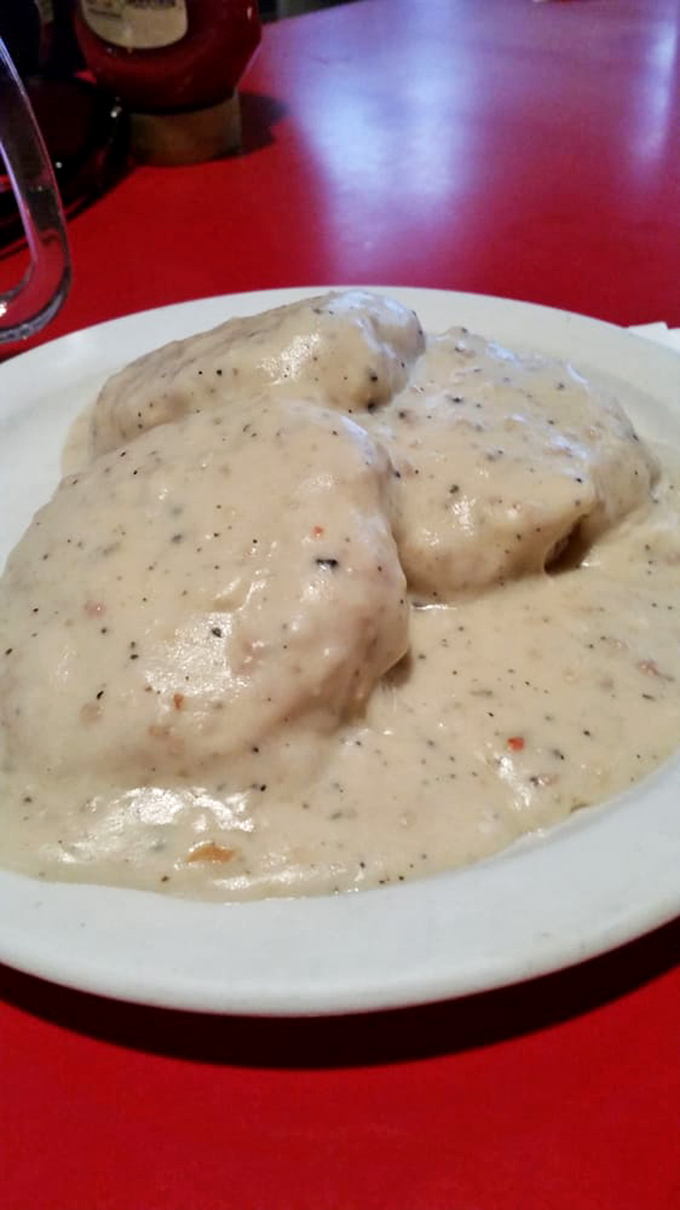 Biscuits and gravy that could convert non-believers &ndash; pillowy islands drowning in a sea of peppery cream gravy that's practically begging for a fork dive.