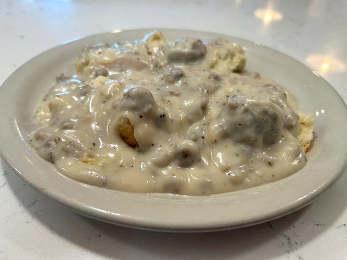Biscuits drowning in creamy sausage gravy &ndash; the kind of comfort food that makes you want to hug the chef and take a nap simultaneously.