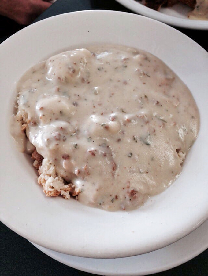 Biscuits hiding beneath a blanket of peppery gravy. Some treasures aren't meant to be seen, just discovered one heavenly forkful at a time.