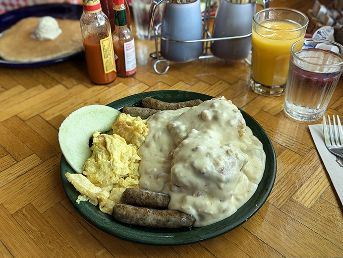 Biscuits drowning happily in creamy gravy alongside scrambled eggs and sausage&mdash;comfort food that hugs you from the inside out.
